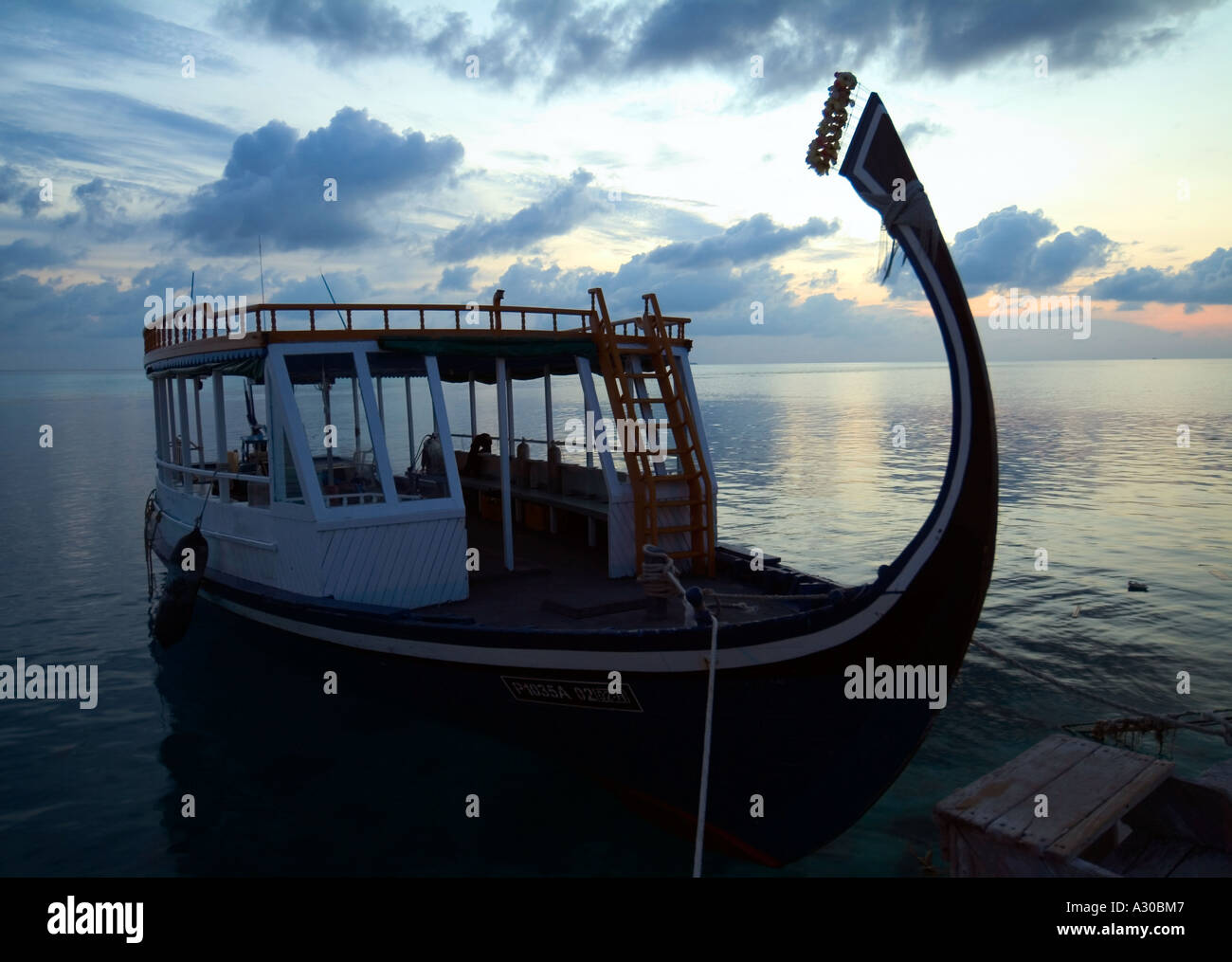 Maldives Dive Boat moored at the jetty Stock Photo - Alamy