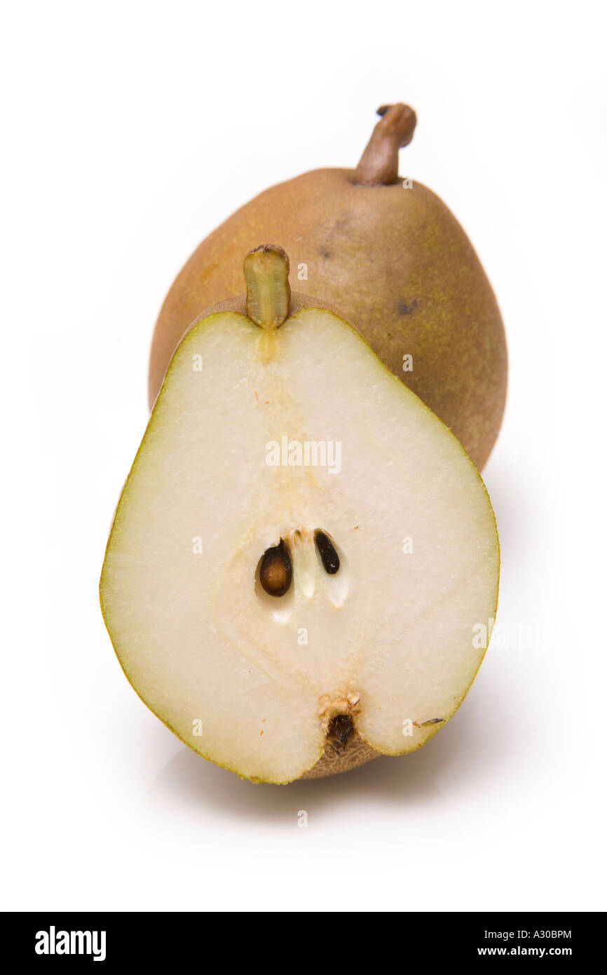 French pears whole and halved isolated on a white studio background ...