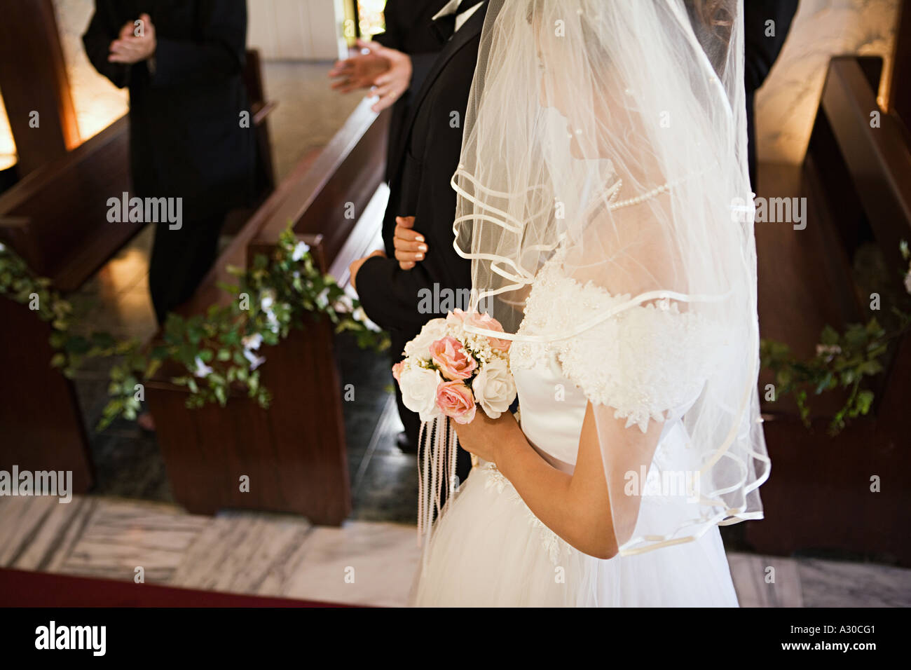 Bride and groom in church Stock Photo - Alamy
