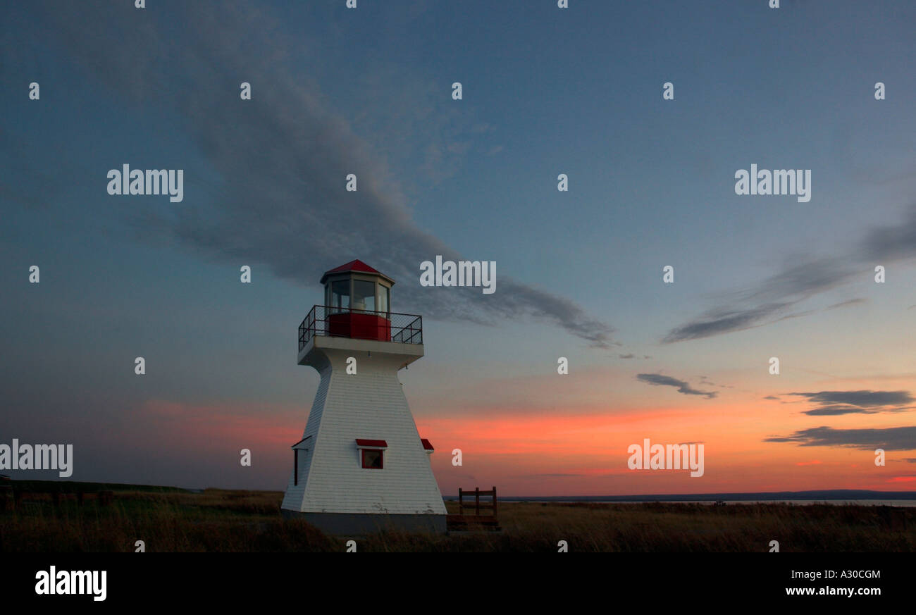The lighthouse at Carleton in Quebec at sunset Stock Photo - Alamy