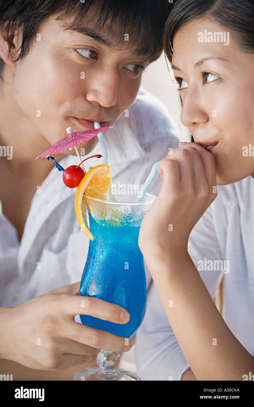 Young asian couple drinking orange hi-res stock photography and images ...
