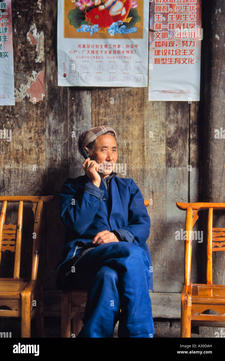 Old man using cellular phone in ancient house Yangtze River area China ...