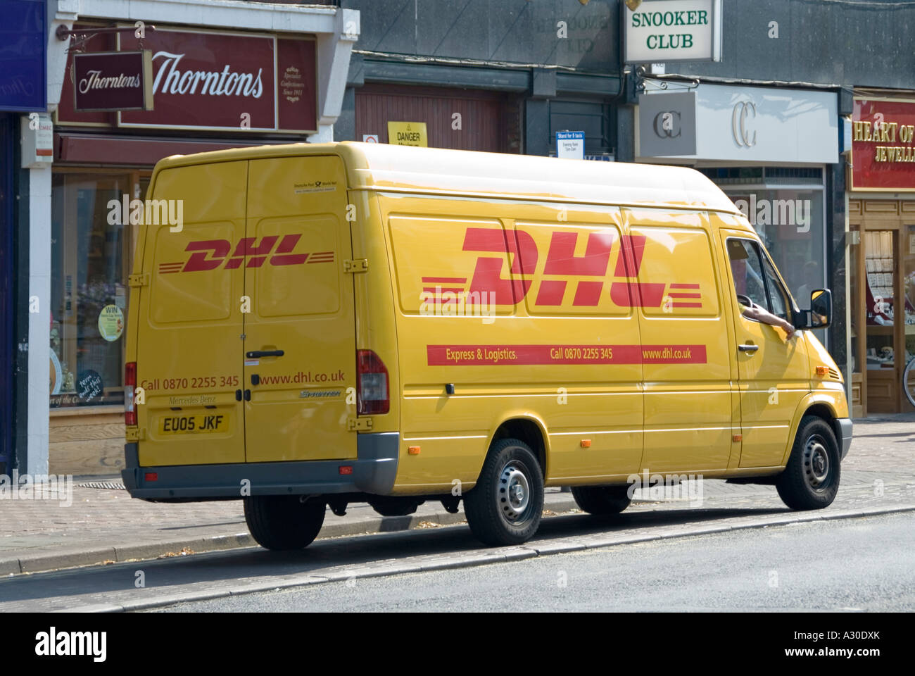 DHL parcel delivery van parked in typical shopping High Street Stock ...