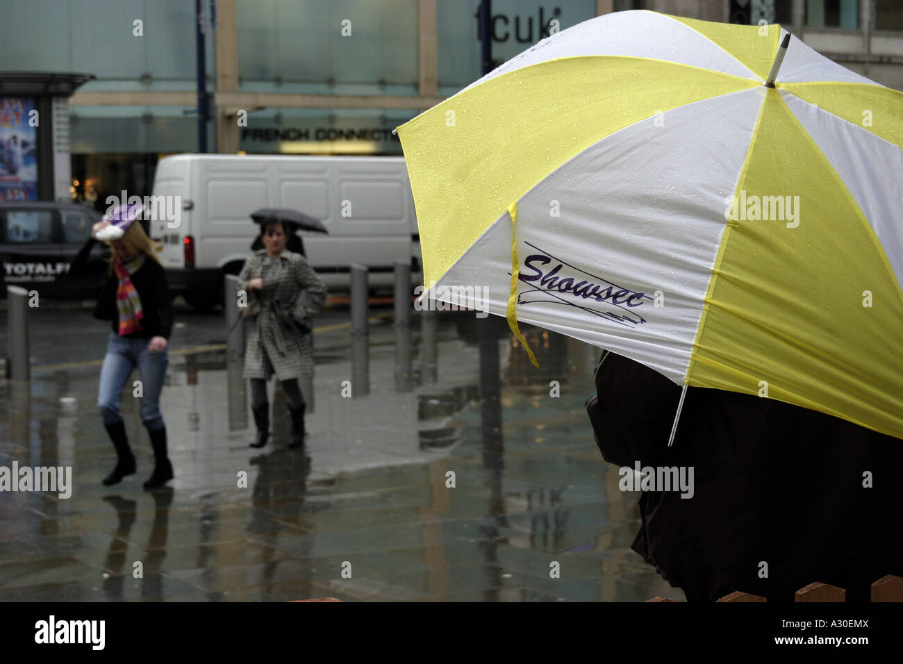 Walking in the Rain in Manchester UK Stock Photo - Alamy