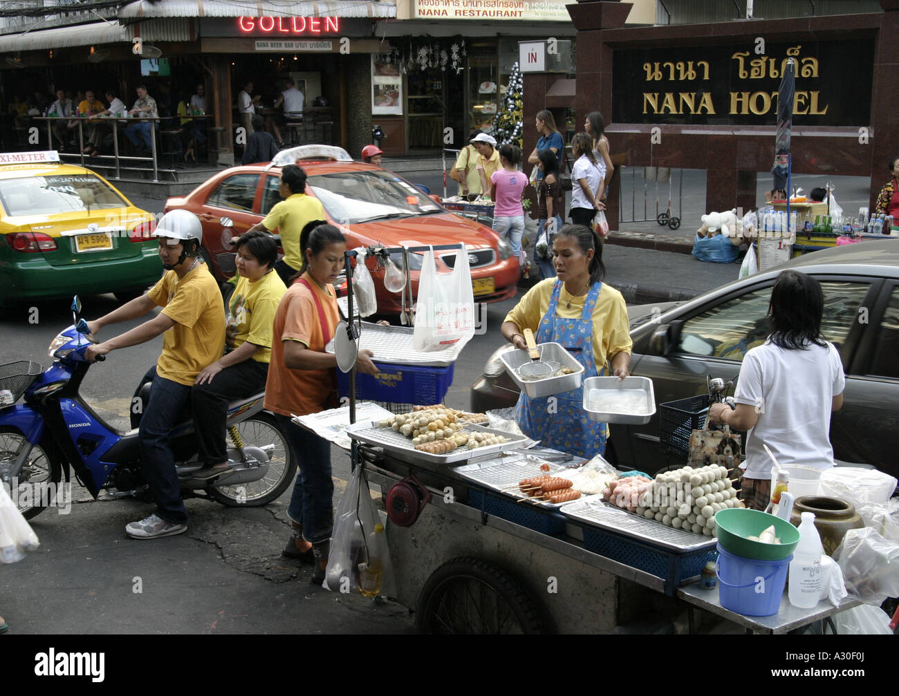 Busy Street Corner outside Nana Plaza entrance facing the Nana Hotel ...