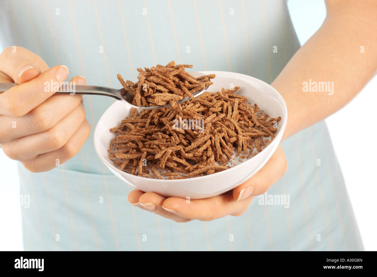 Woman eating all bran breakfast cereal hi-res stock photography and ...