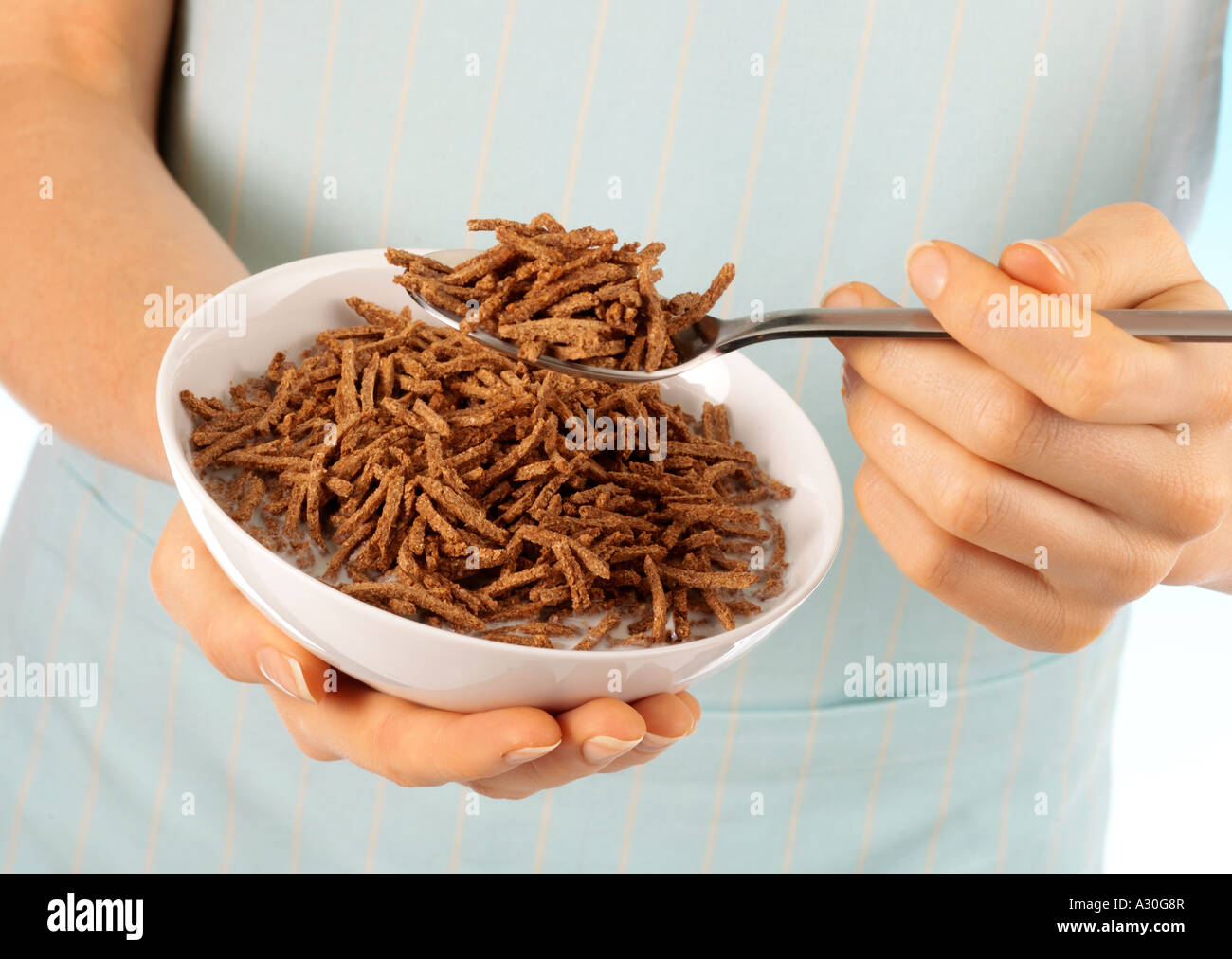 Woman eating all bran breakfast cereal hi-res stock photography and ...