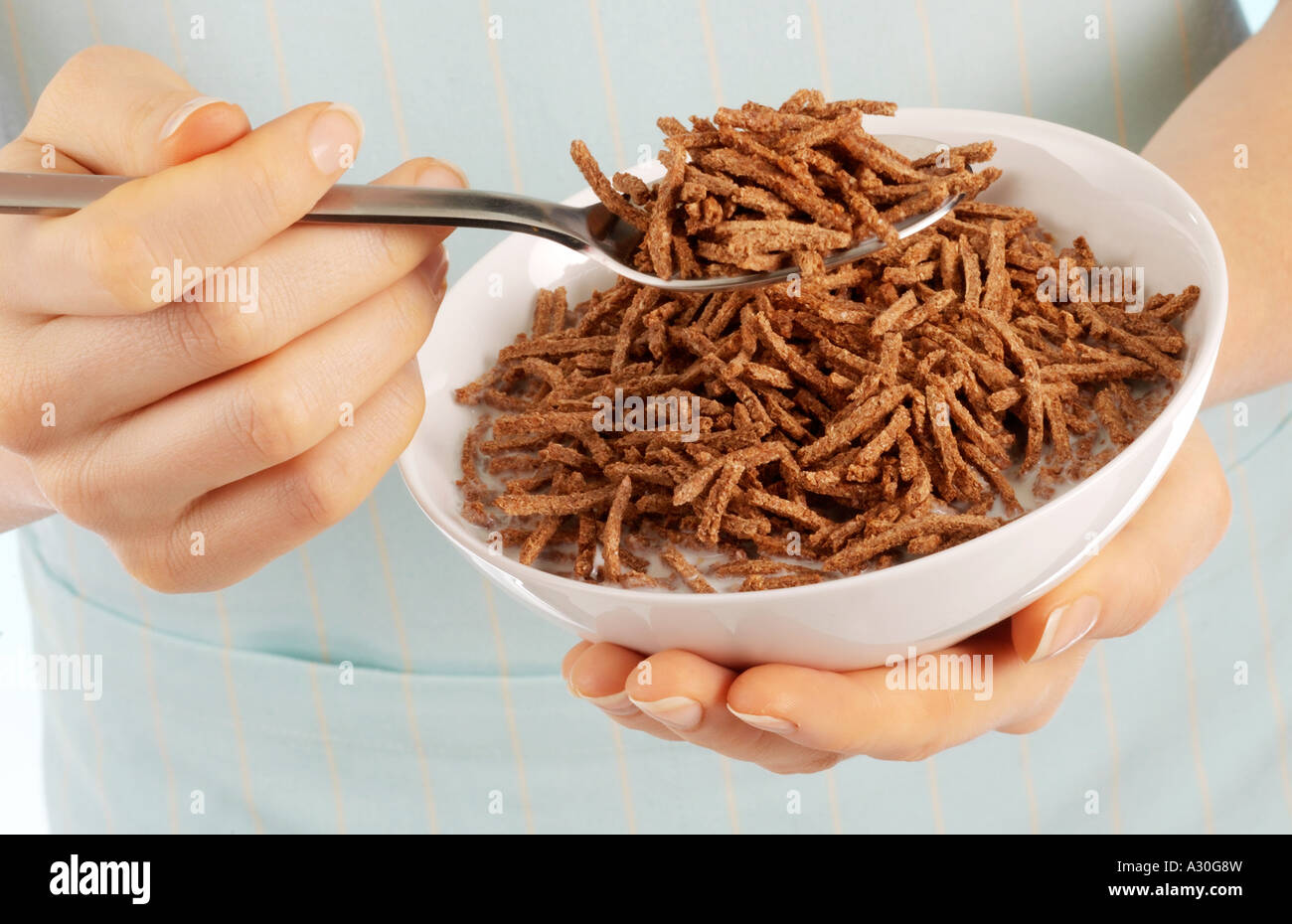 WOMAN EATING ALL-BRAN BREAKFAST CEREAL Stock Photo - Alamy