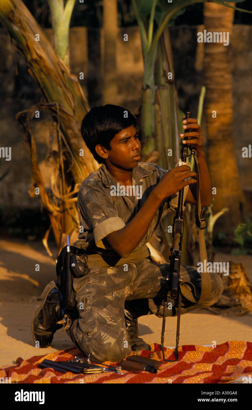 12 year old tamil tiger learning to strip and assemble his ak 47 gun Jaffna Sri Lanka Stock ...