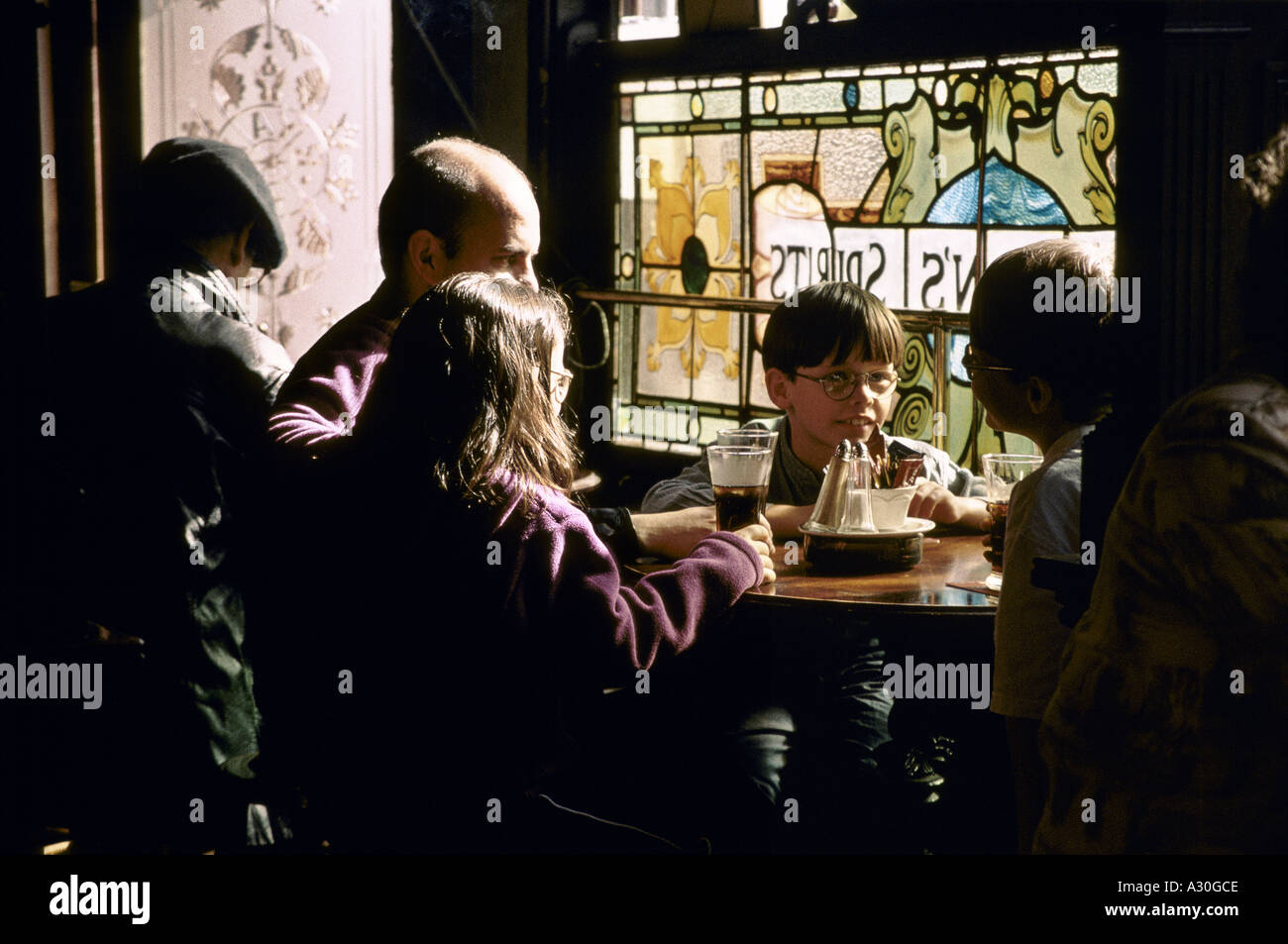 family with children in a pub waiting for their lunch dublin 2001 Stock ...