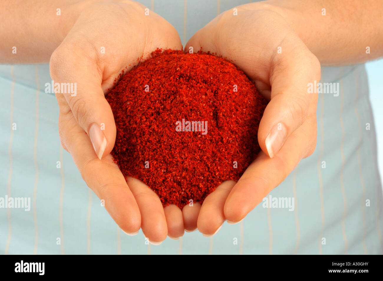 HANDFUL OF CHILLI POWDER Stock Photo - Alamy