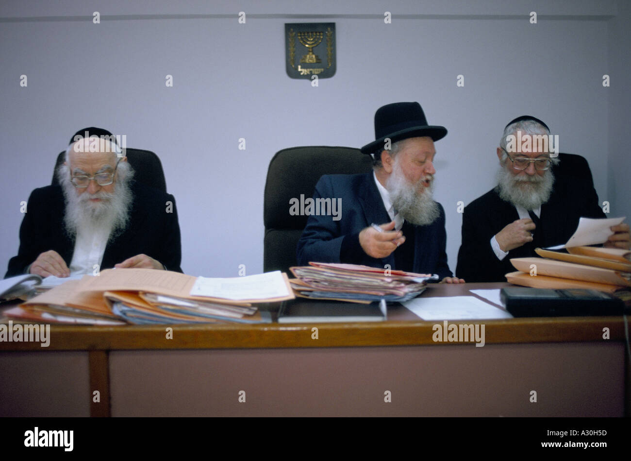 Three Rabbis sit in judgement in the Rabbanical court in Jerusalem ...