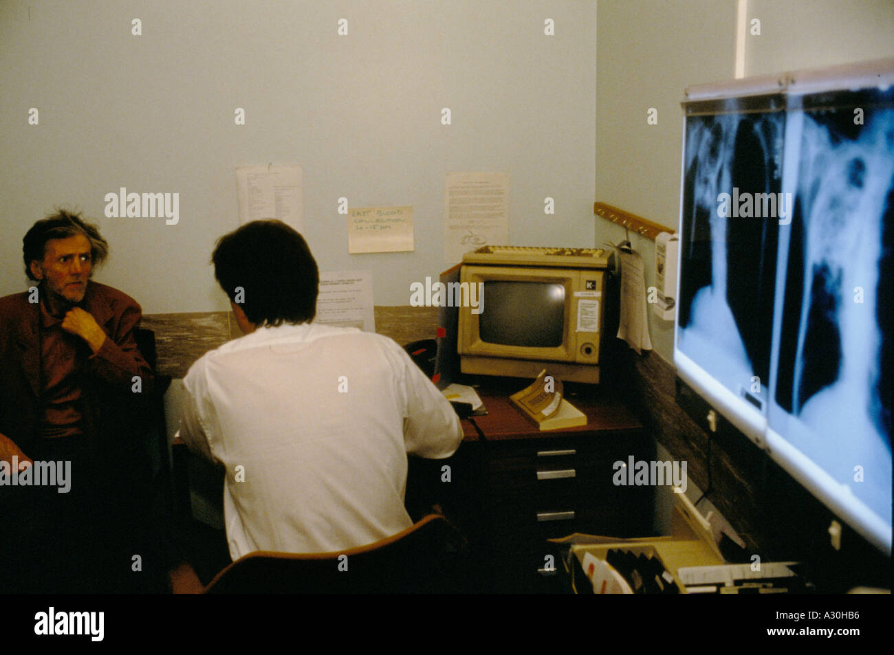 A homeless man with tuberculosis is shown his x ray by a doctor at ...