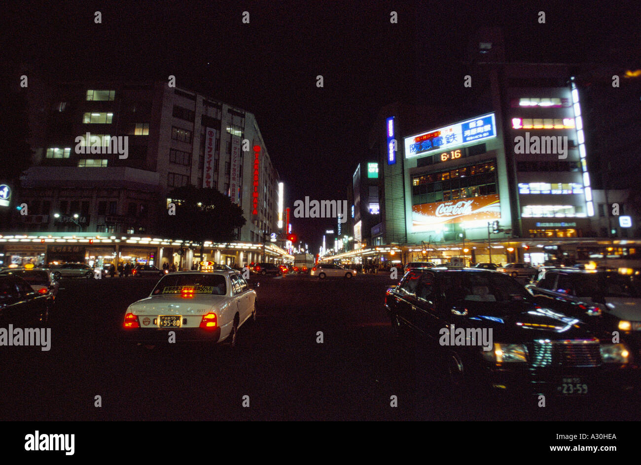 Traffic and advertising signs at night in Kyoto Japan Stock Photo - Alamy