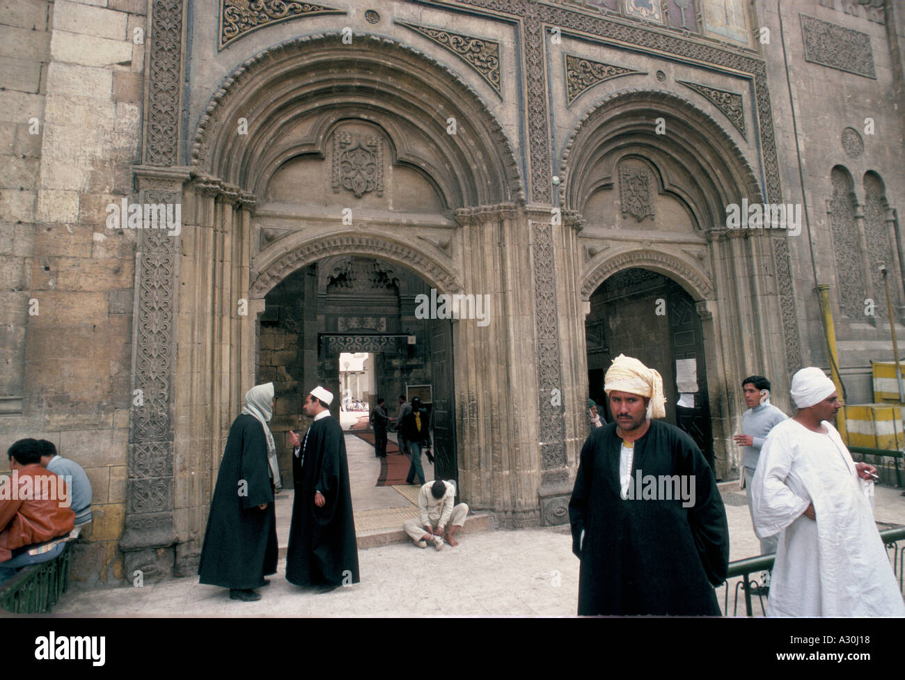 men outside mosque cairo egypt Stock Photo - Alamy