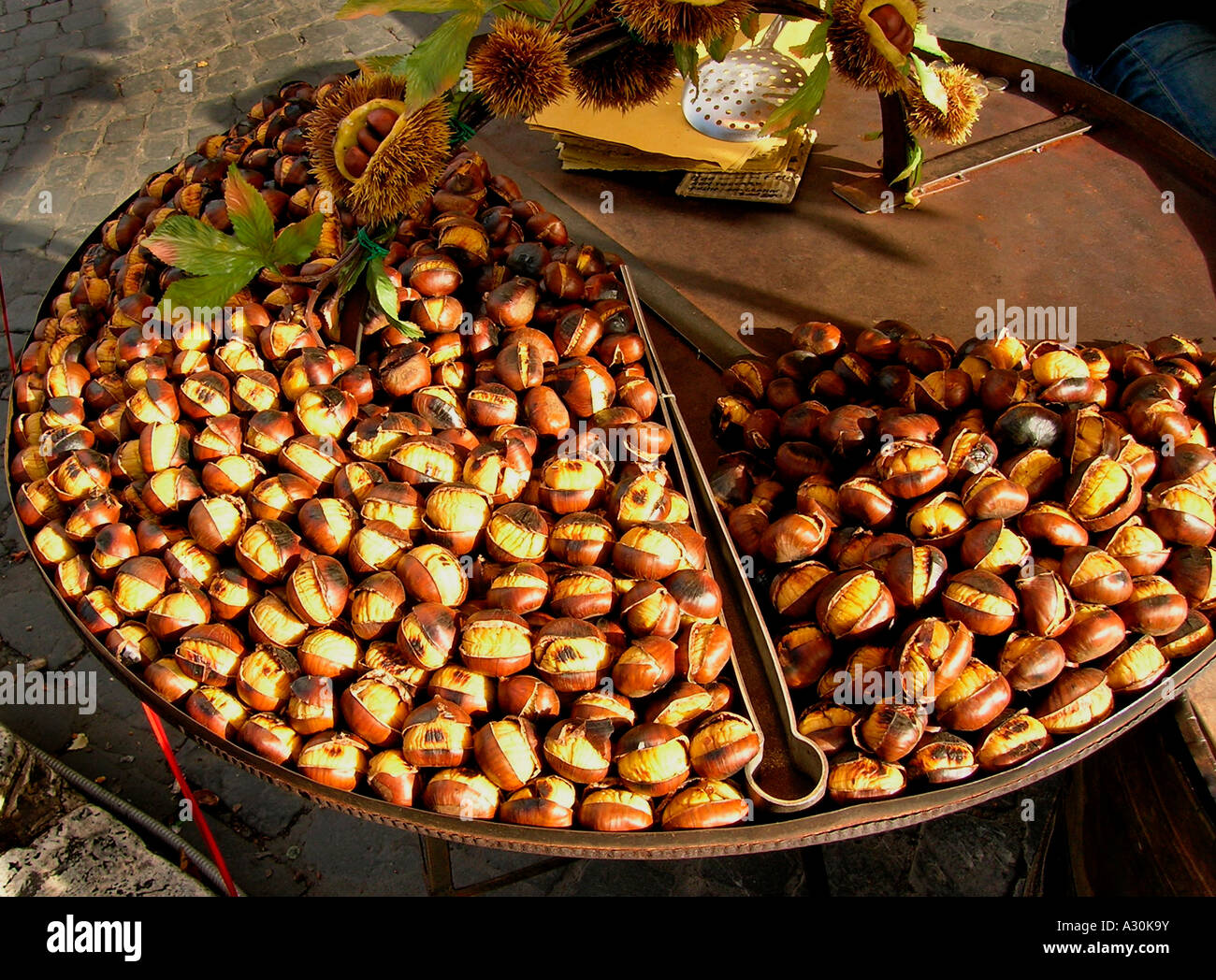 Man roasting chestnuts hi-res stock photography and images - Alamy