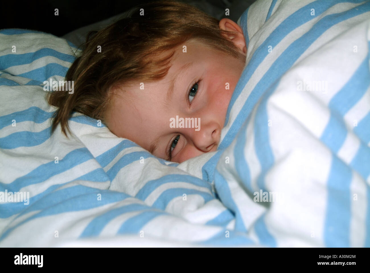 Snuggled up in bed hi-res stock photography and images - Alamy