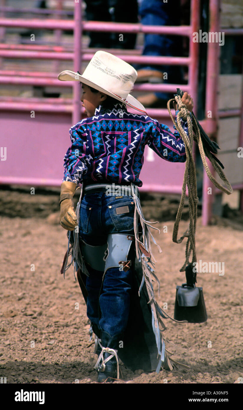 A young native American gets ready to take part in a rodeo for children ...