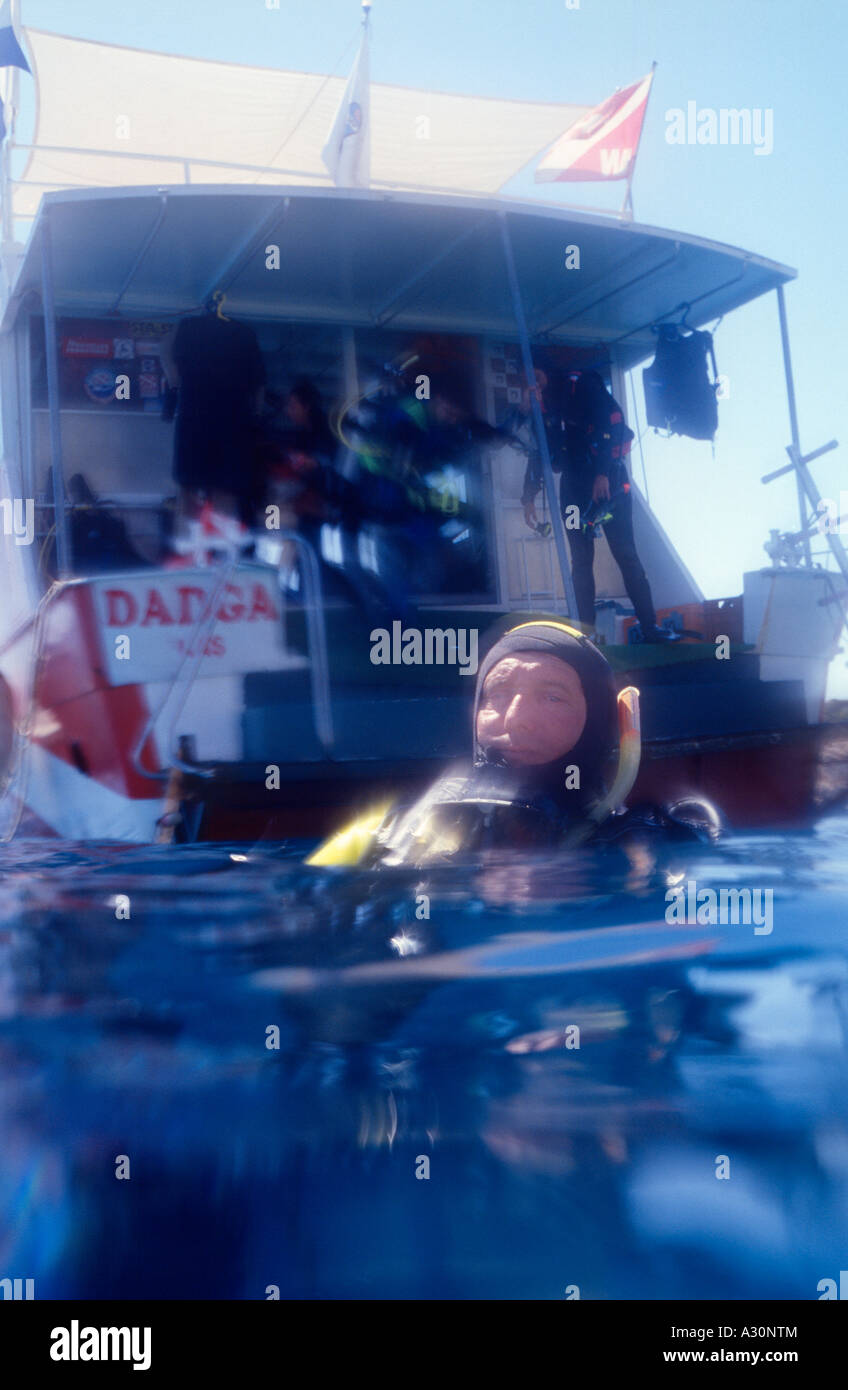 Scuba divers in the water and on a dive boat Kas, Antalya, Turkey Stock ...