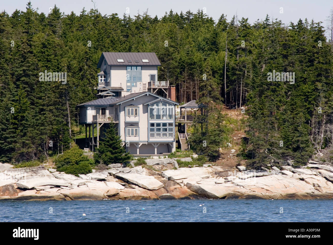 A house along the shore in the Muscle Ridge Channel, Maine Stock Photo ...