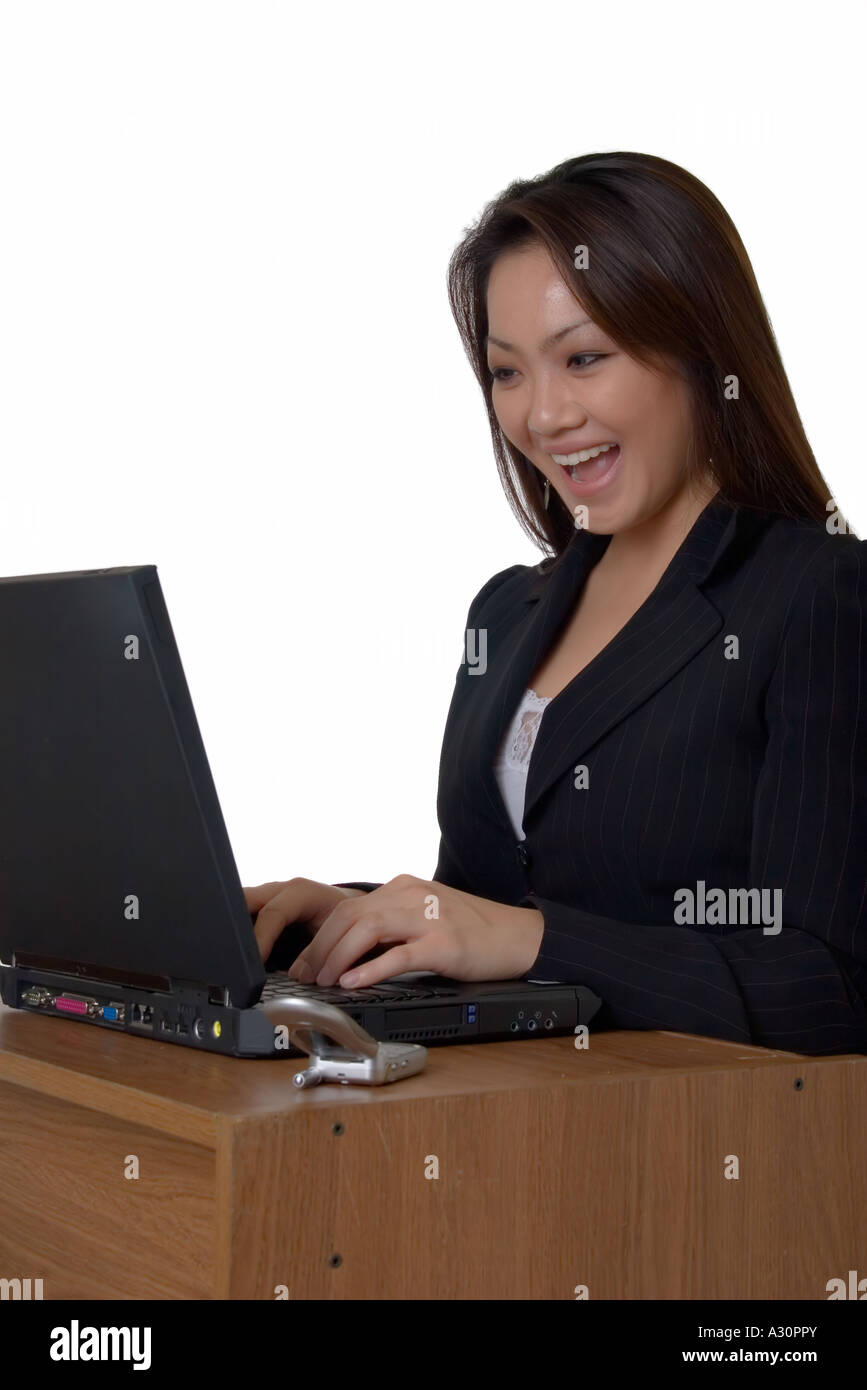 Reading a funny email Stock Photo - Alamy