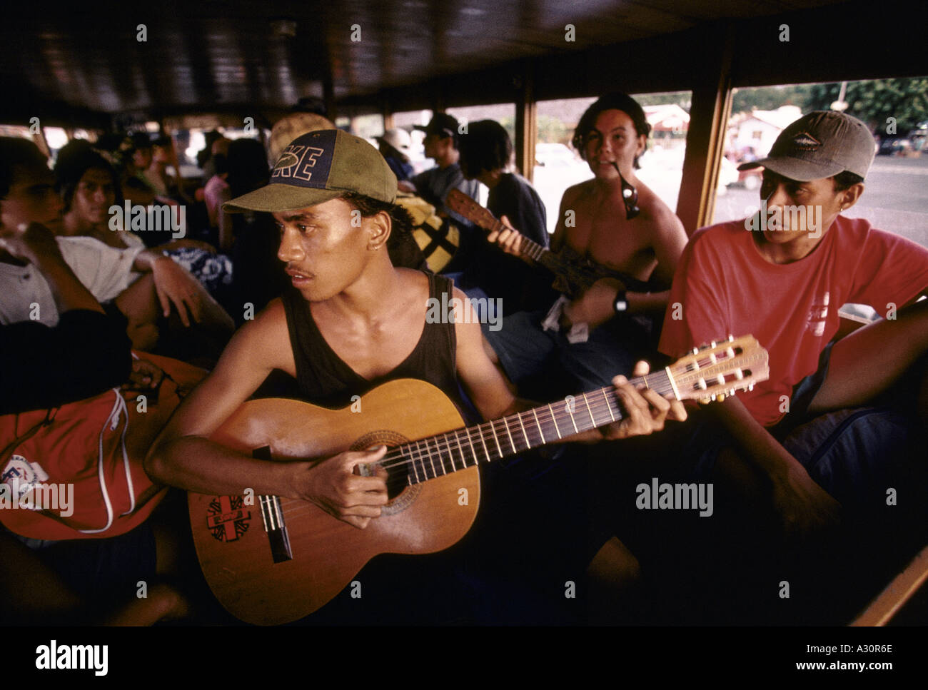 french polynesia tahiti papeete man playing guitar on a public bus 1995 ...