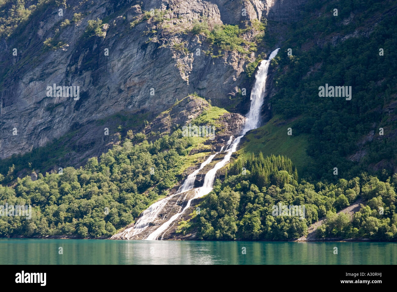 A waterfall in the Geiranger Fjord Geirangerfjorden Norway Stock Photo ...