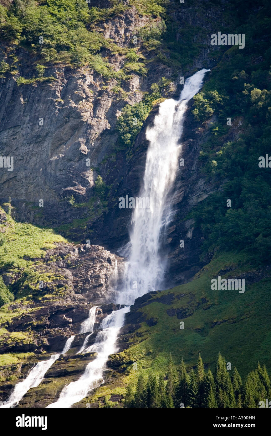 A waterfall flowing into the Geiranger Fjord Geirangerfjorden Norway ...
