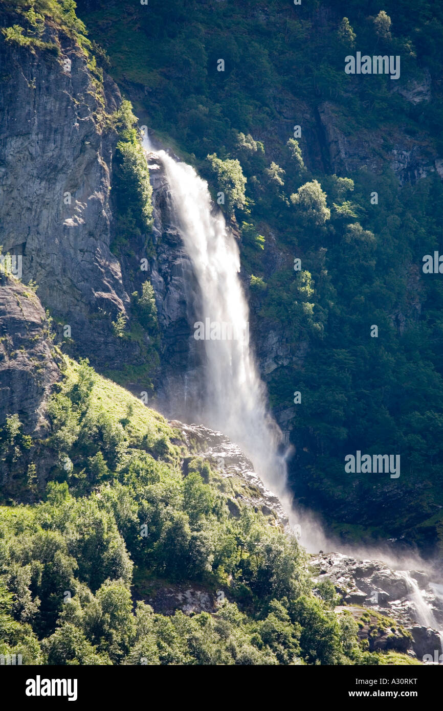 A waterfall flowing into the Geiranger Fjord Geirangerfjorden Norway ...
