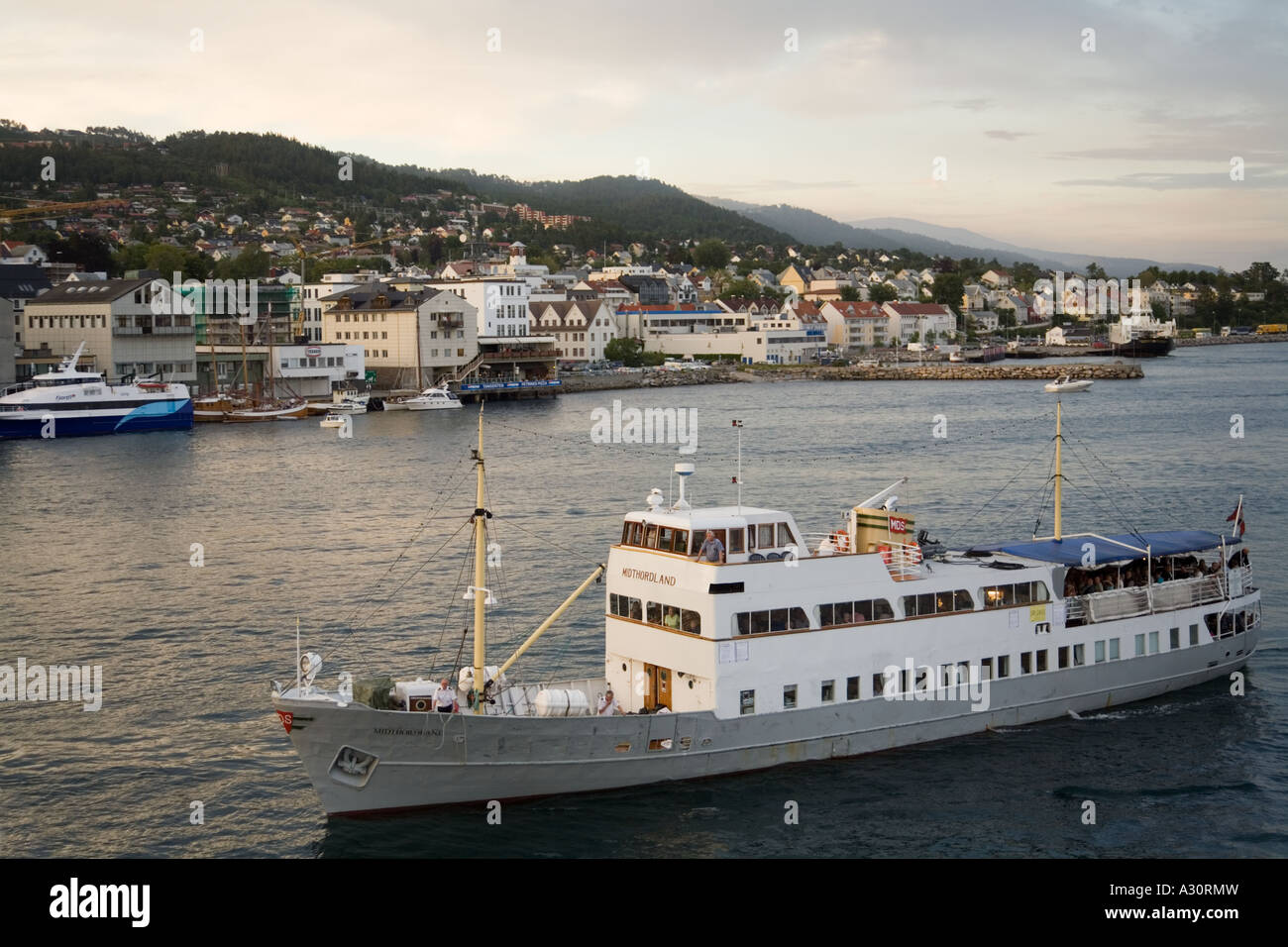 Evening light in the harbour at Molde, Norway Stock Photo - Alamy
