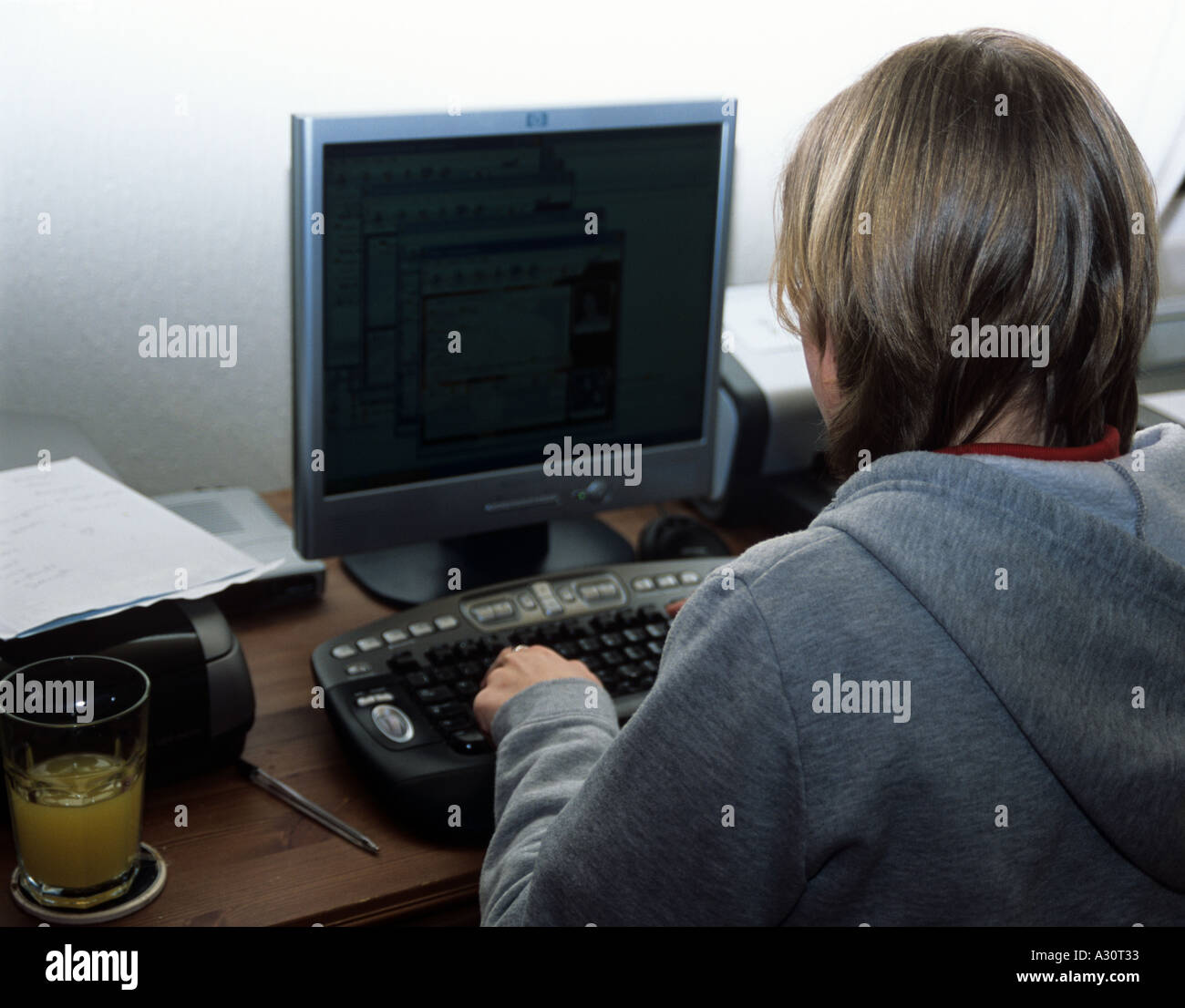 Teenage Girl typing on computer Stock Photo - Alamy