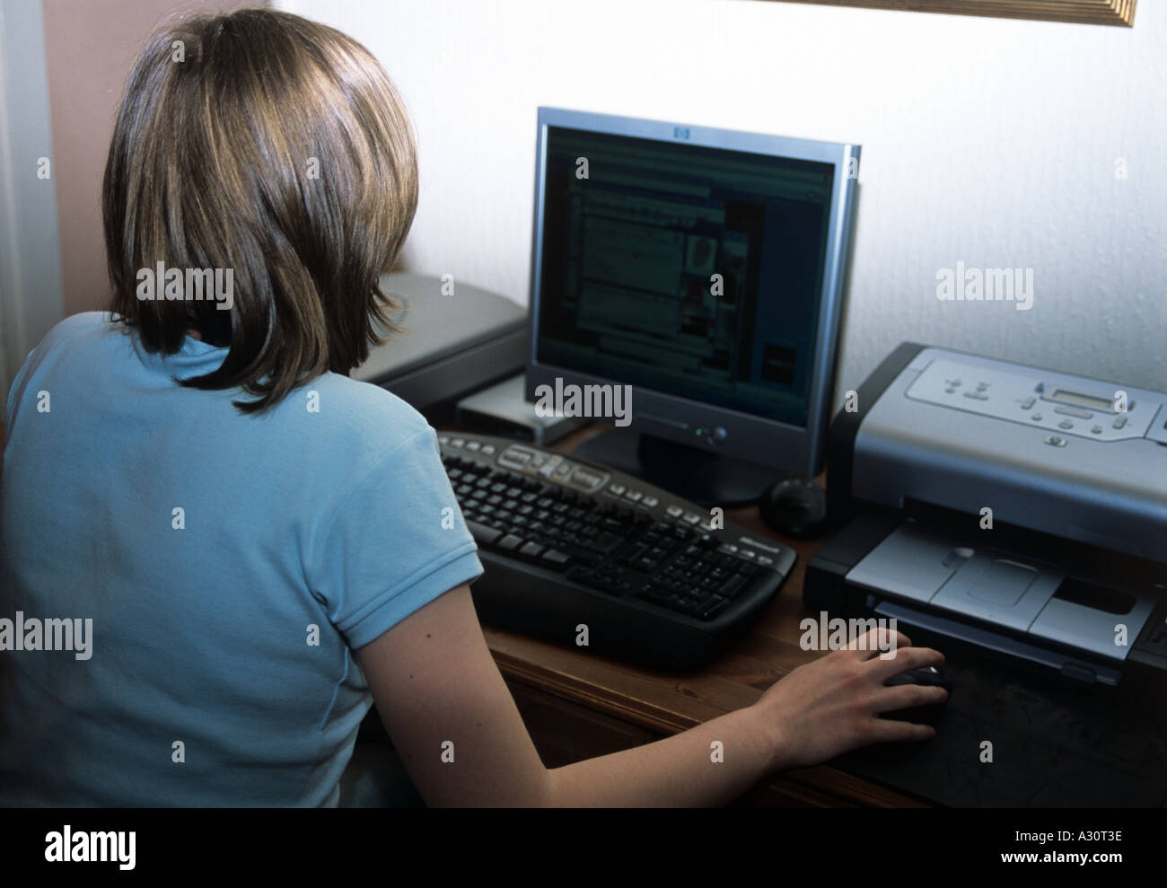 Teenage Girl typing on computer Stock Photo - Alamy