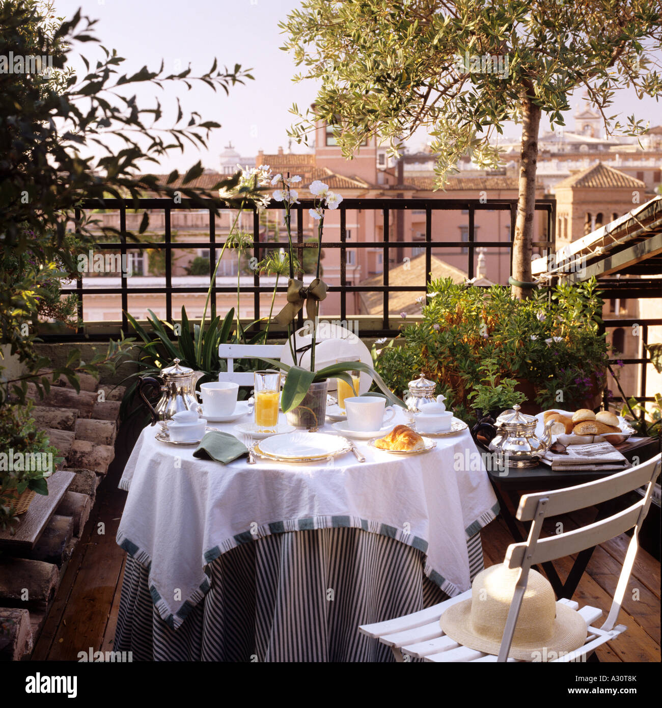 breakfast table on a roof terrace in Rome Stock Photo - Alamy