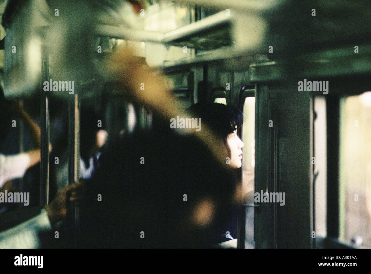 tokyo japan a woman looks out of the window of the tokyo rapid transit ...