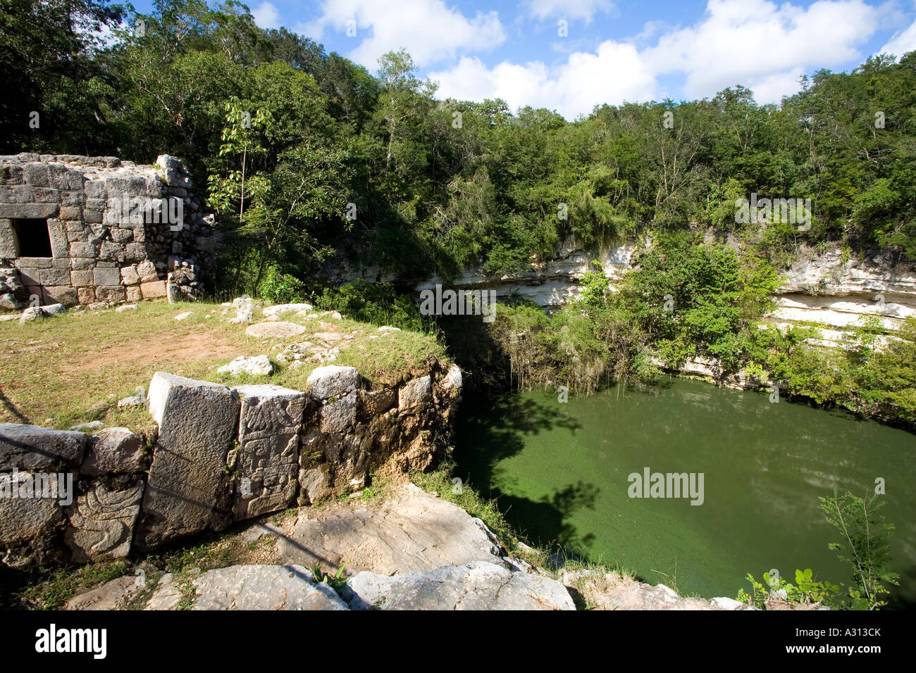 Cenote a sacred well used for human sacrifice at the ruined Mayan city ...