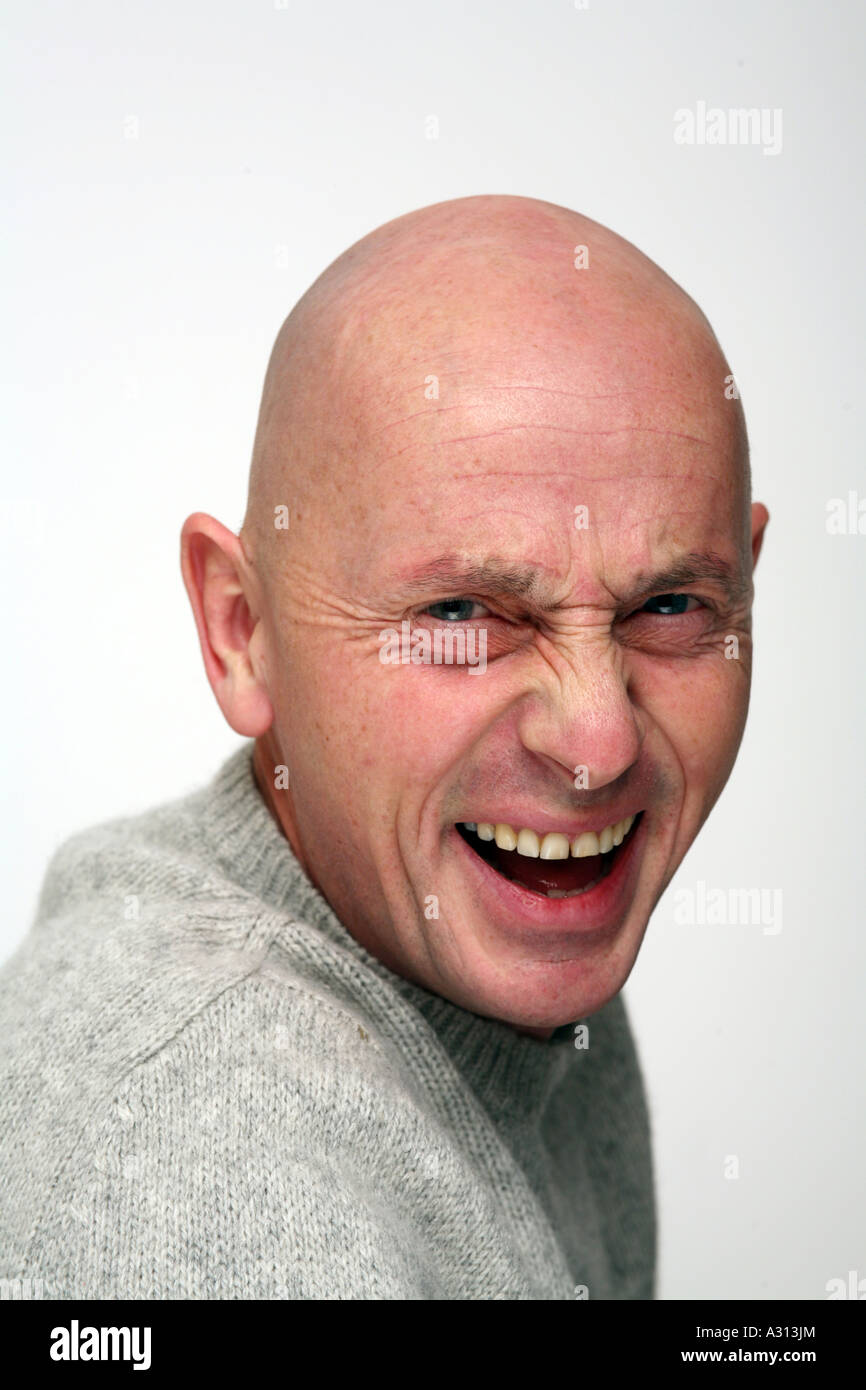 Bald man laughing at camera Stock Photo: 10635403 - Alamy