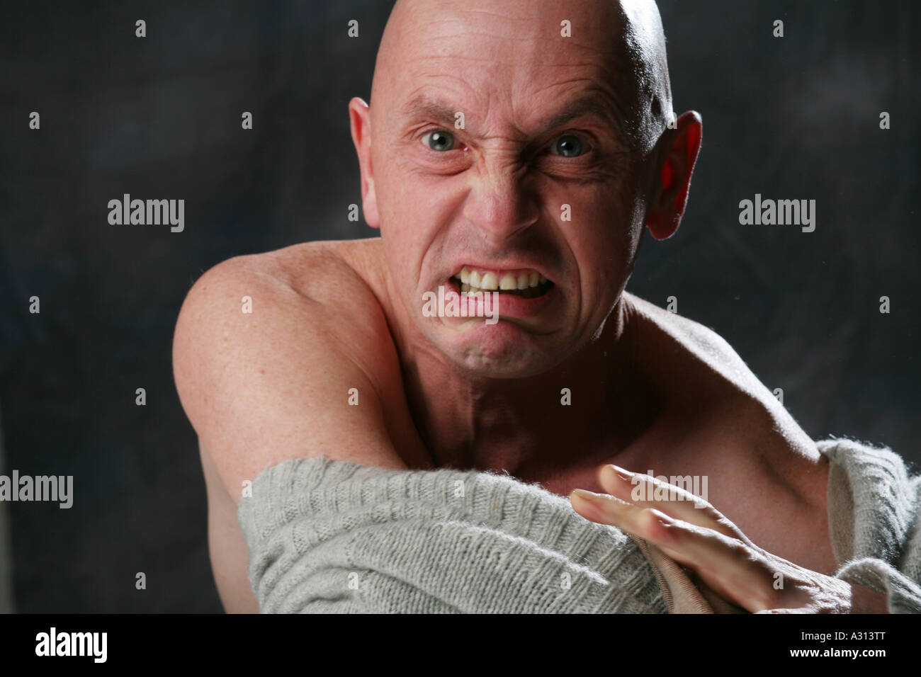Studio shoot of angry bald man Stock Photo - Alamy