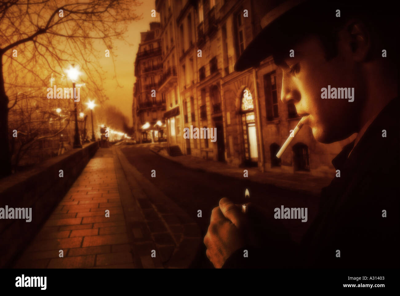 man lighting a cigarette at night Stock Photo - Alamy