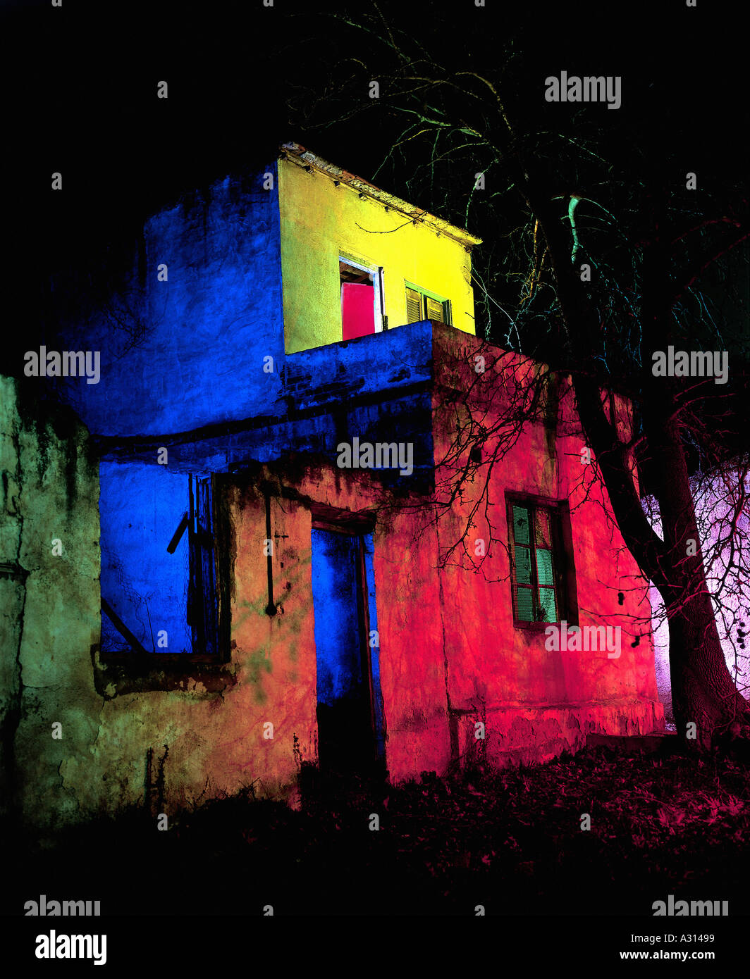Old tri colored deserted house Stock Photo - Alamy