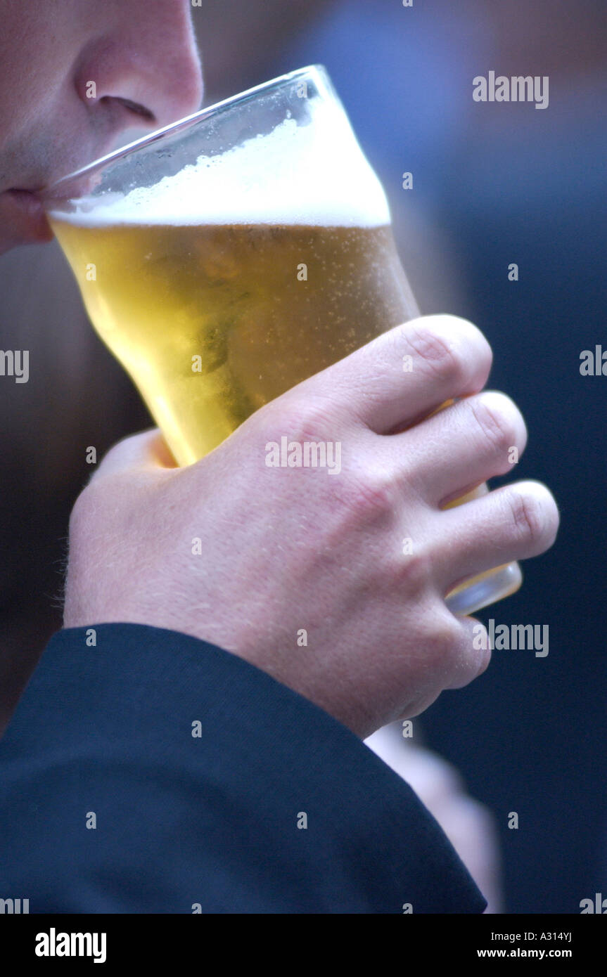 Royalty free photograph of British business man drinking pint of beer ...