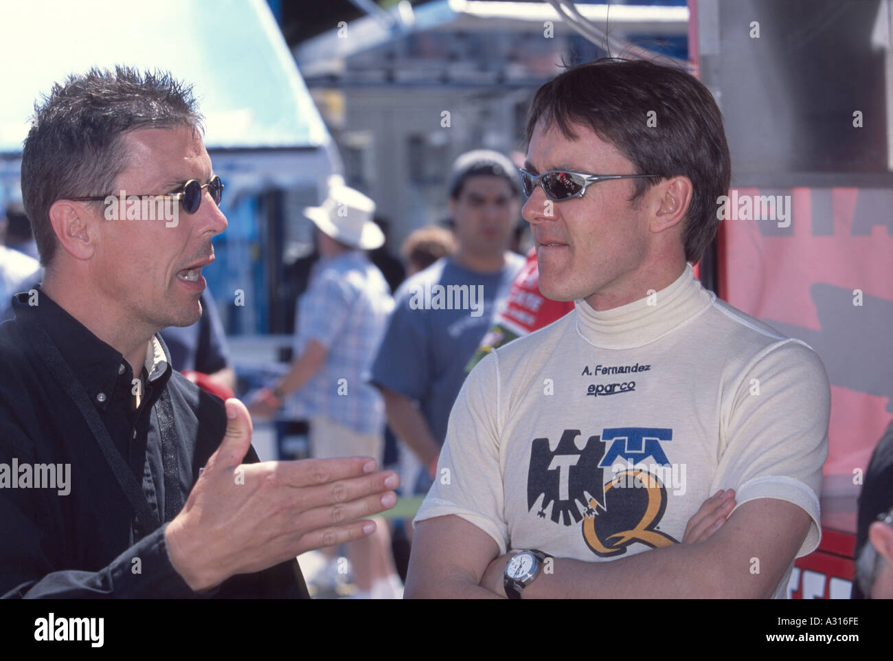 Scott Pruett and Adrian Fernandez chat at the Milwaukee CART race 2002 ...