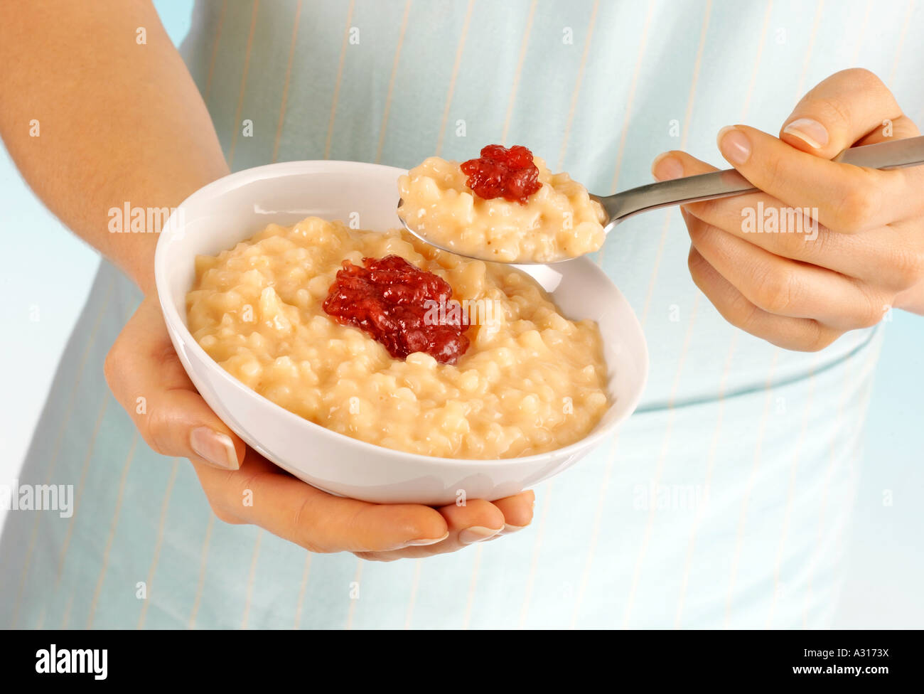 Woman eating rice pudding hi-res stock photography and images - Alamy