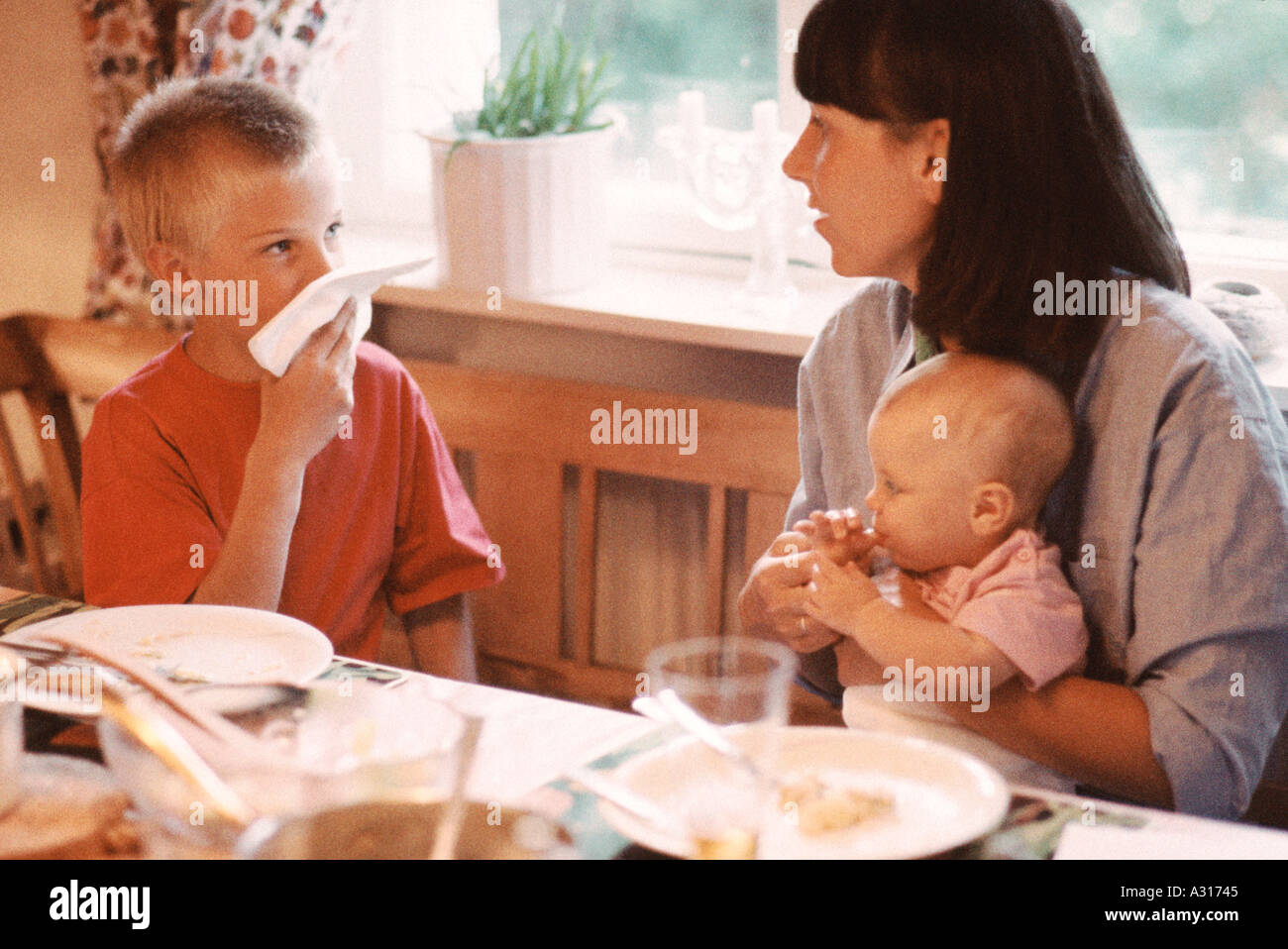 Children eating table manners hi-res stock photography and images - Alamy