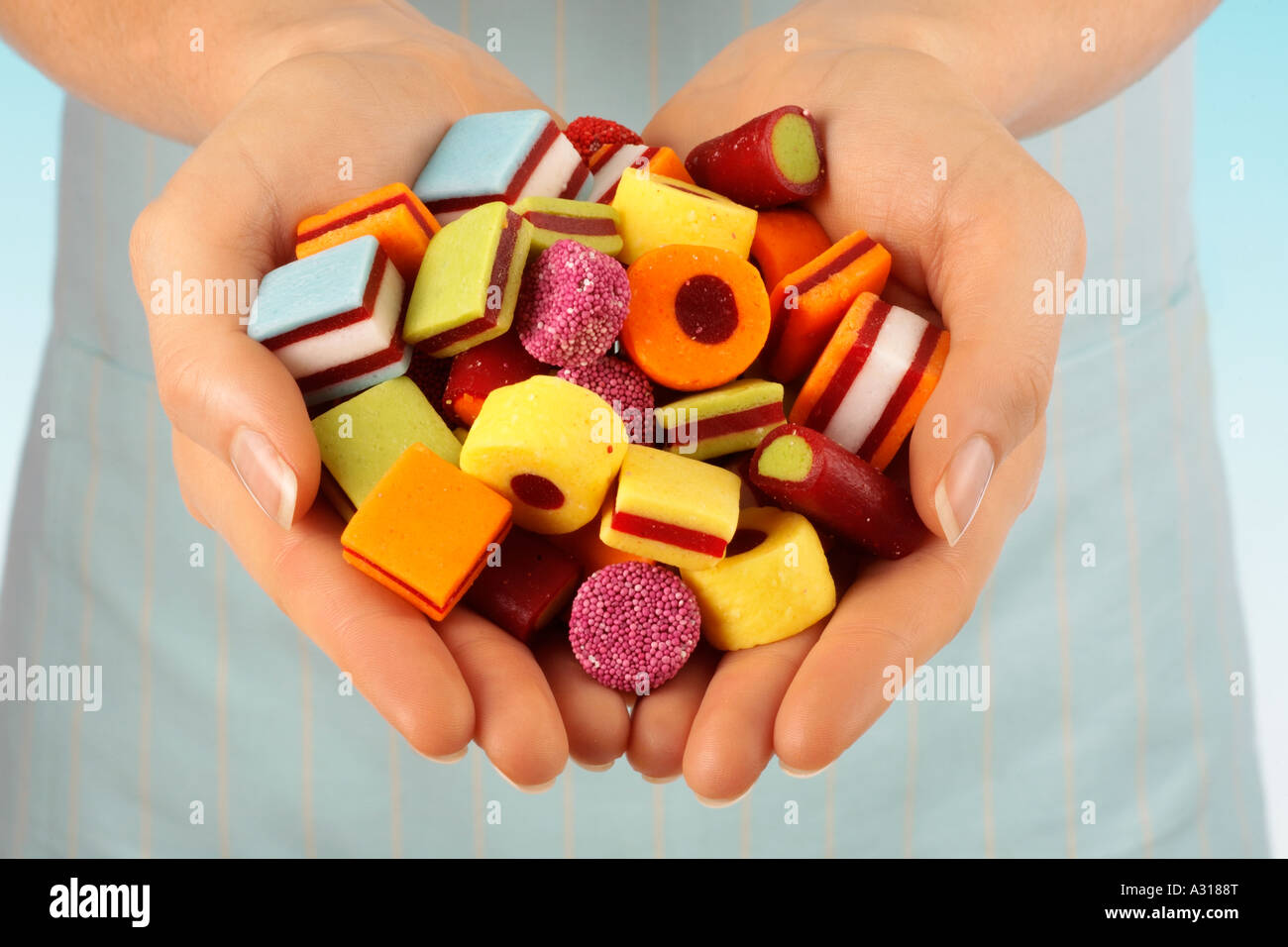 WOMAN HOLDING LICORICE ALLSORTS SWEETS / CANDIES Stock Photo - Alamy