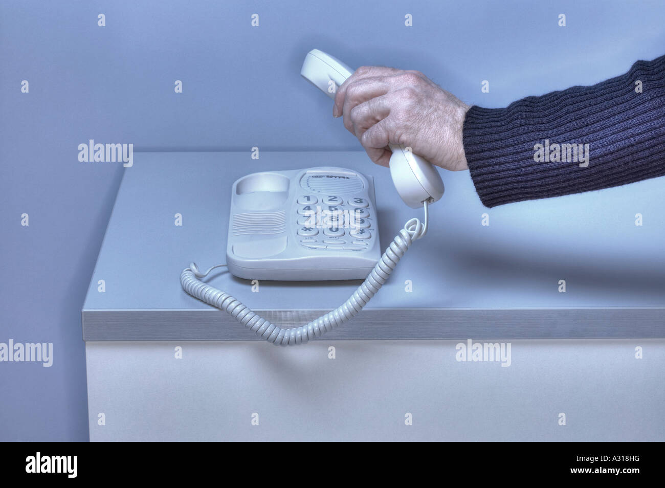 hand picking up telephone Stock Photo - Alamy