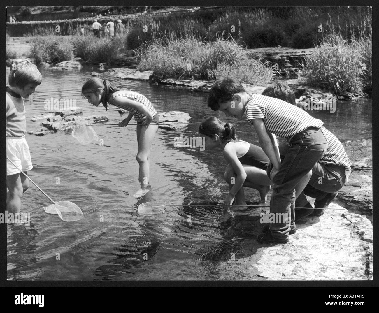 Children Fish In Stream Stock Photo - Alamy