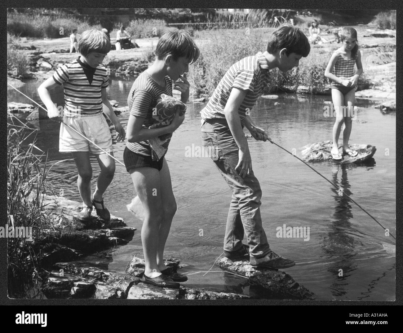Children Fish In Stream Stock Photo - Alamy