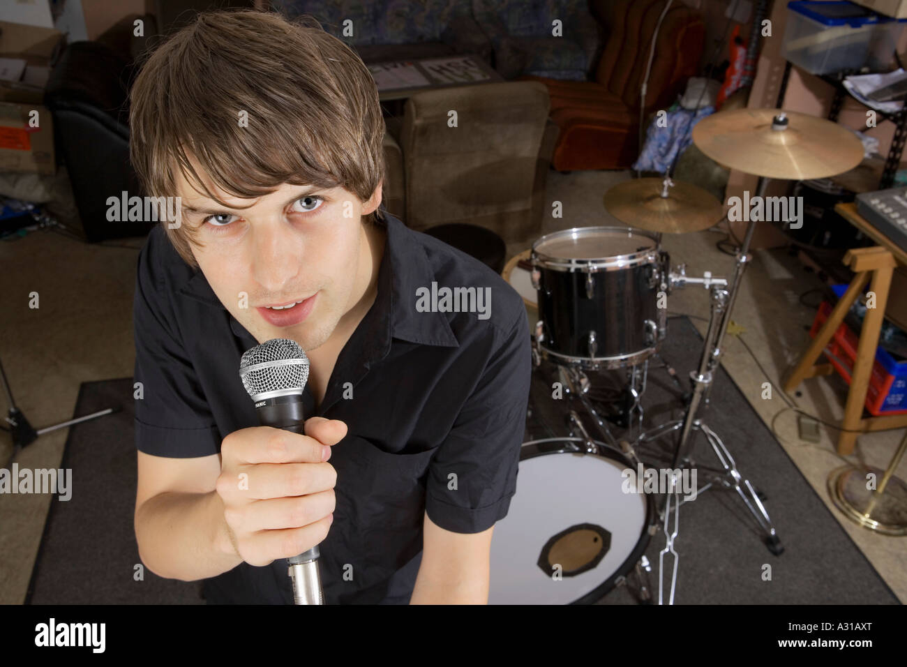 Singer of band practicing in studio Stock Photo - Alamy