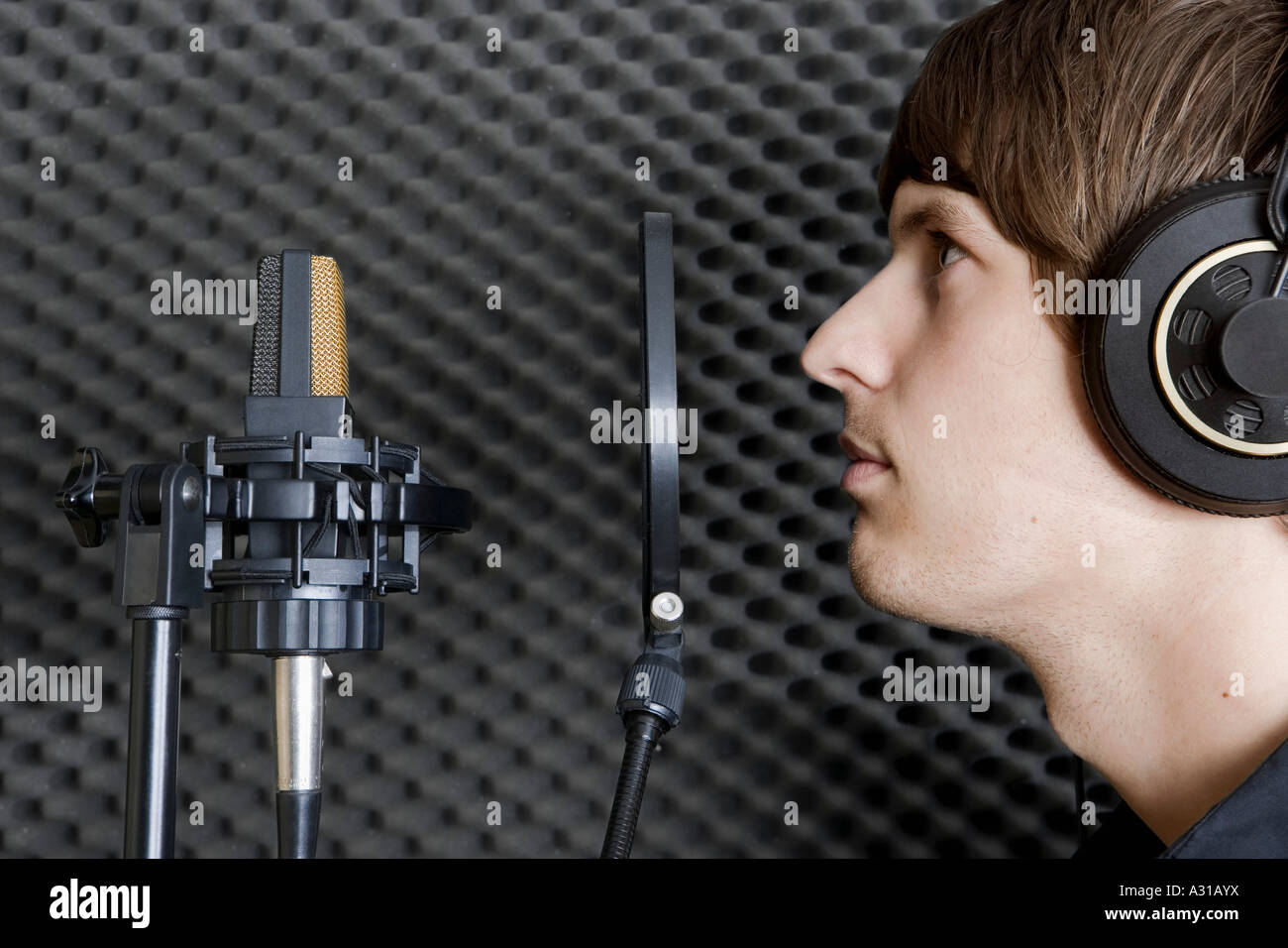 Man in sound booth of recording studio Stock Photo - Alamy