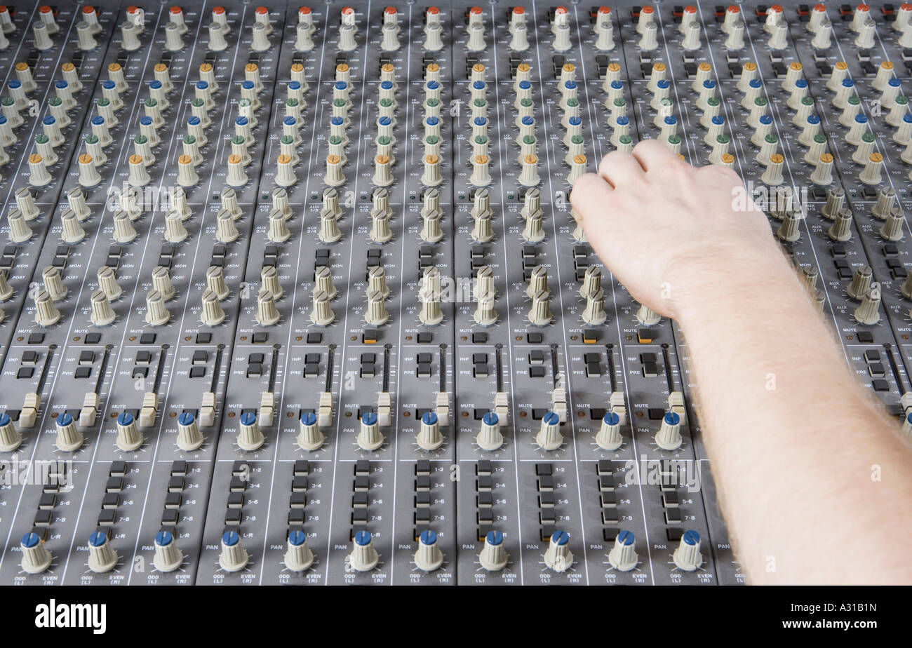 Hand operating sound mixer Stock Photo - Alamy